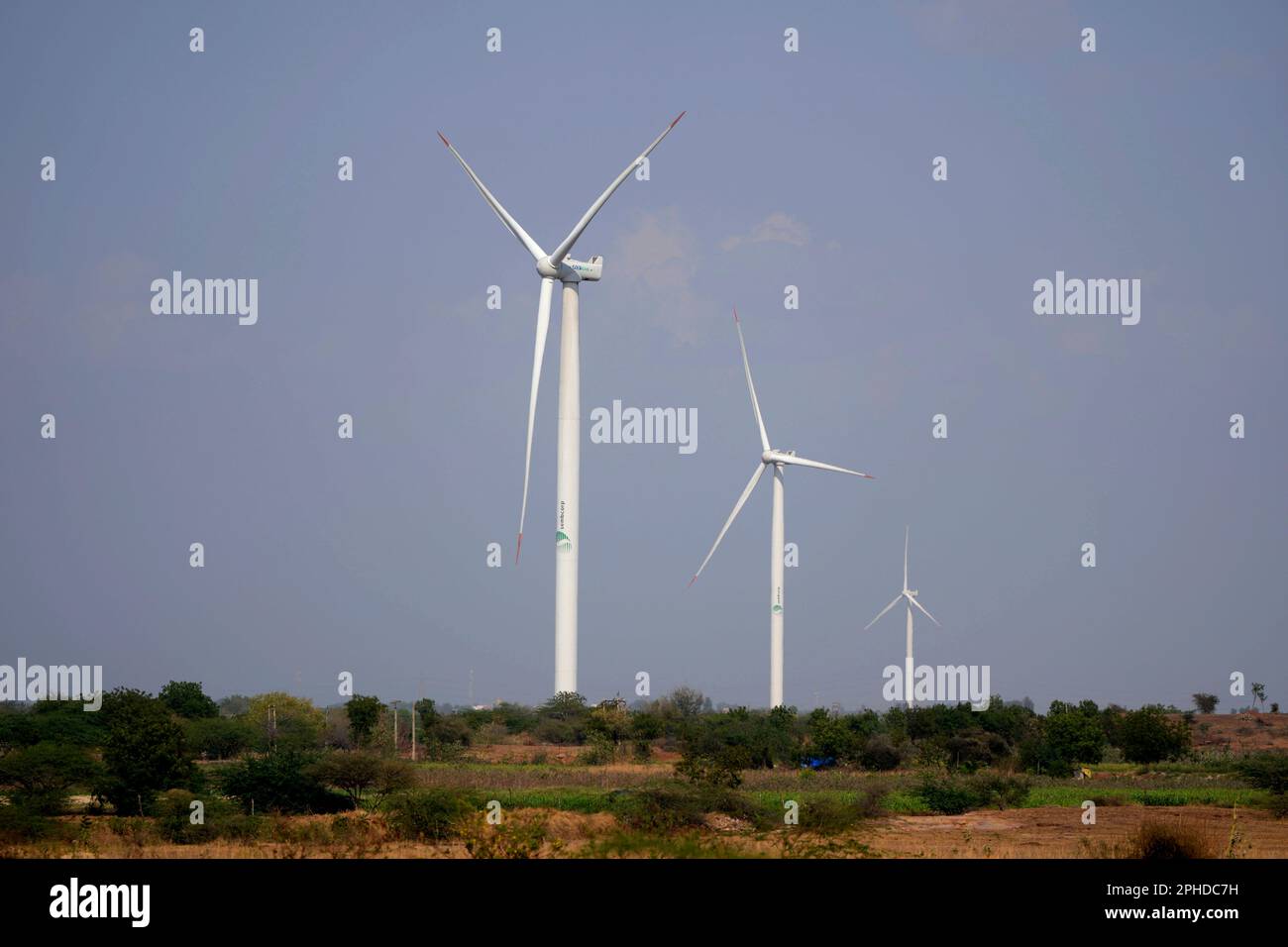 Wind turbines, an Adani Group project, work near Sadla village in ...
