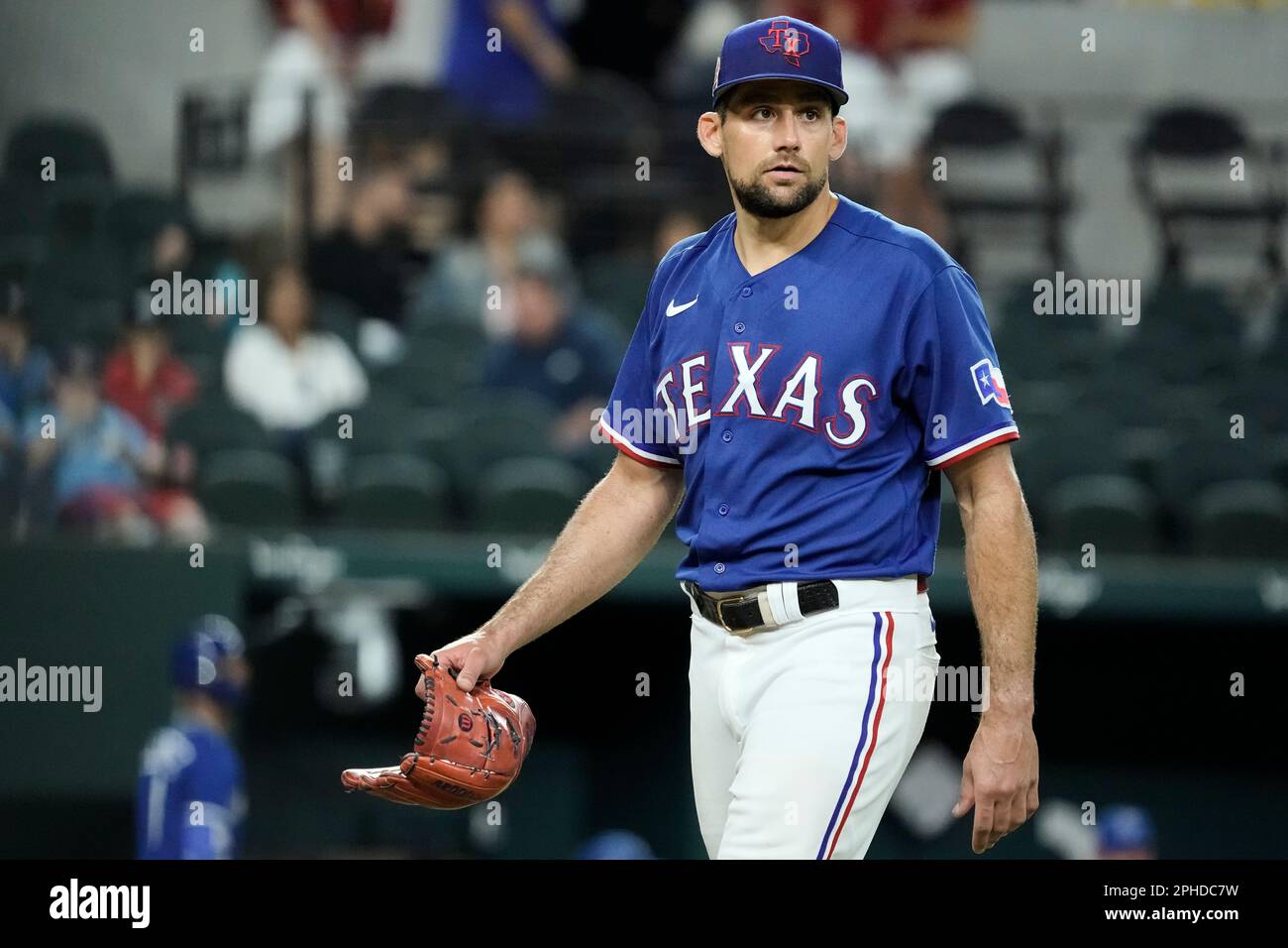 Texas Rangers starting pitcher Nathan Eovaldi (17) walks back to the ...