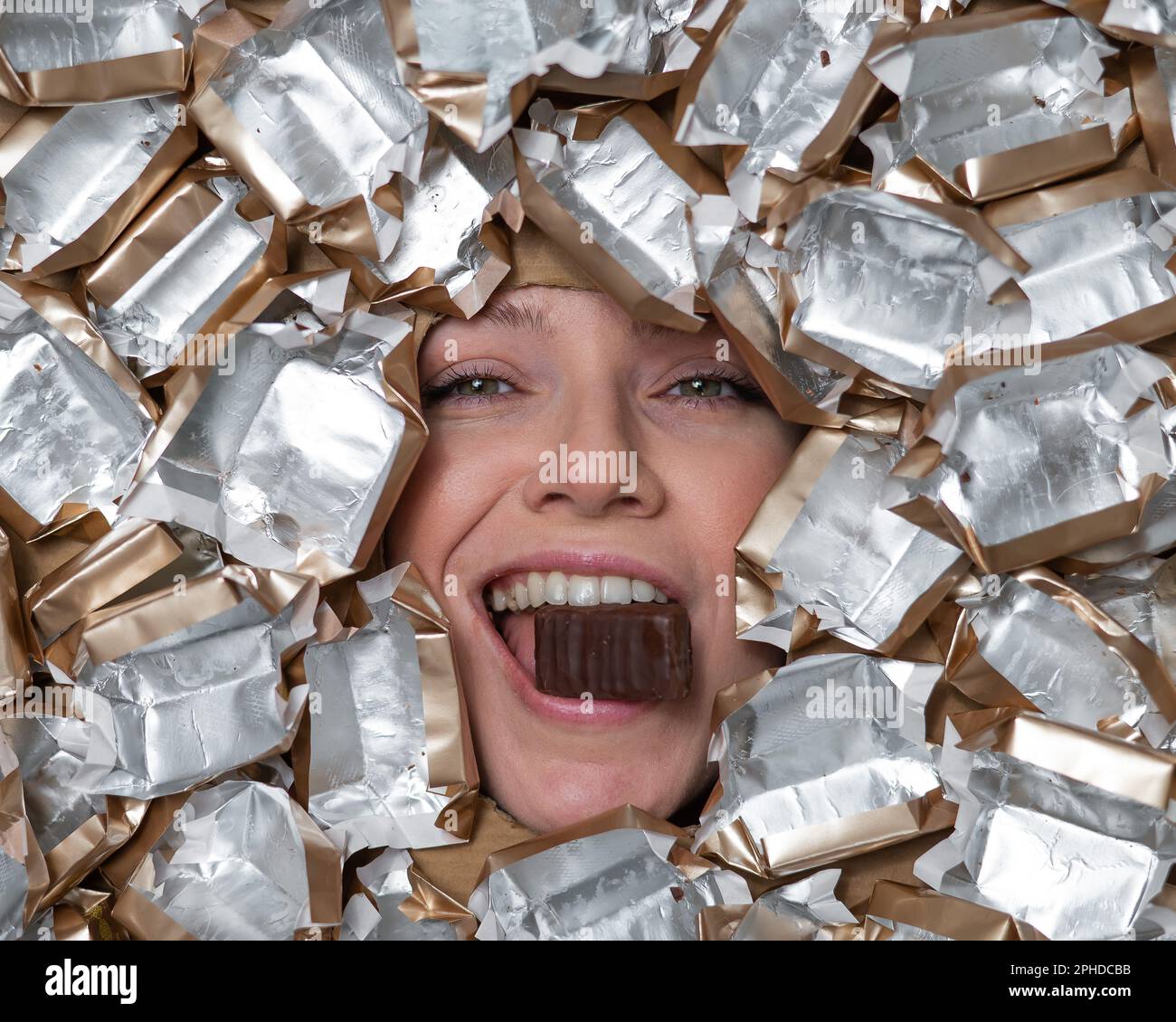 Eating chocolates wrappers hi-res stock photography and images - Alamy