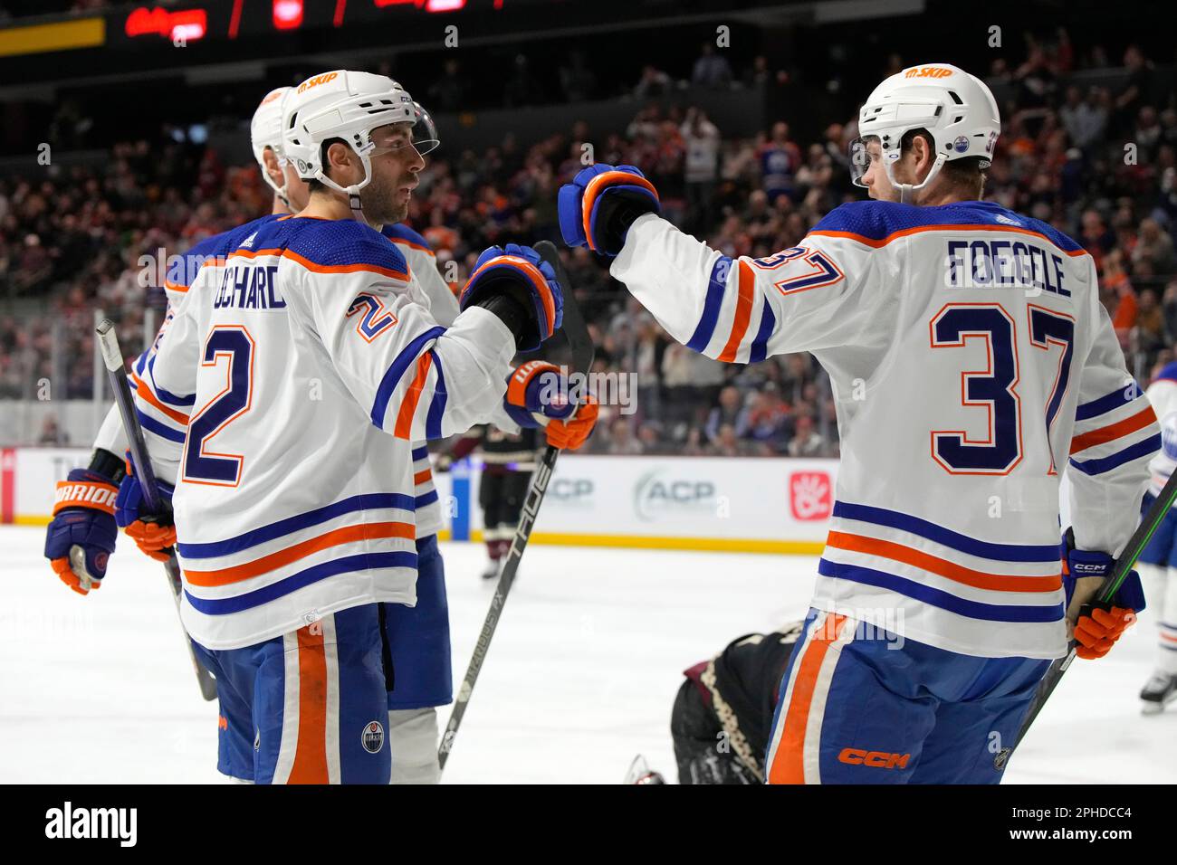 Edmonton Oilers defenseman Evan Bouchard (2) celebrates with left wing ...