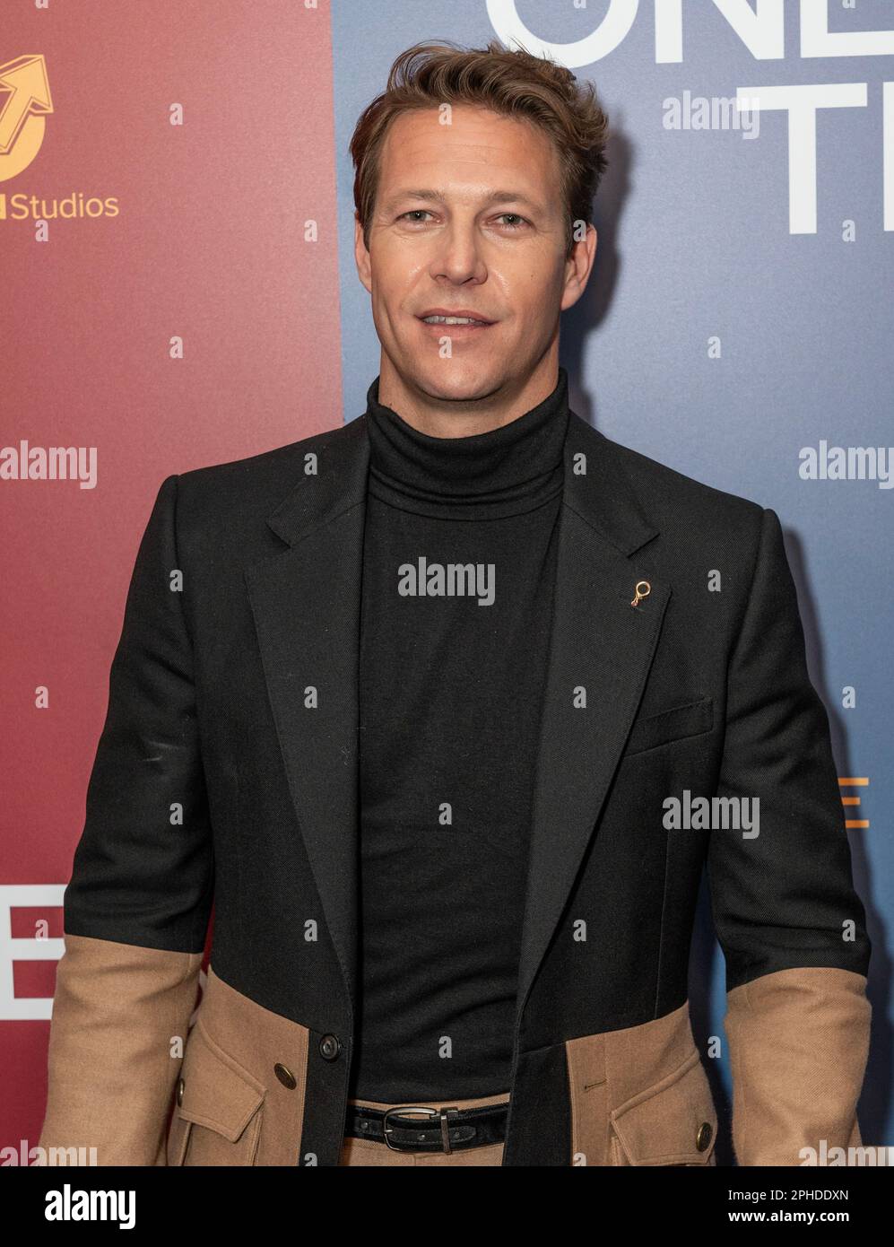 Luke Bracey wearing suit by Alexander McQueen attends premiere of One ...