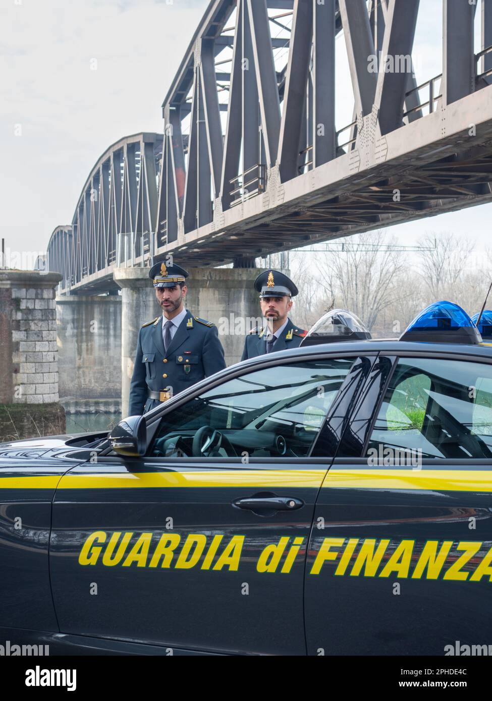 Cremona, Italy - February 2023 two tax police officers in duty near Po ...