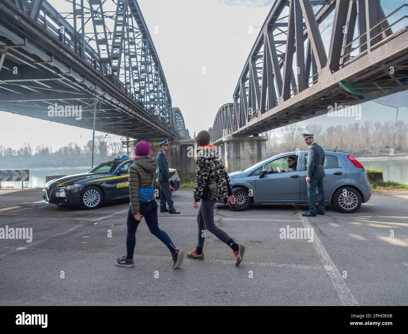 Cremona, Italy - February 2023 two tax police officers in duty near Po ...