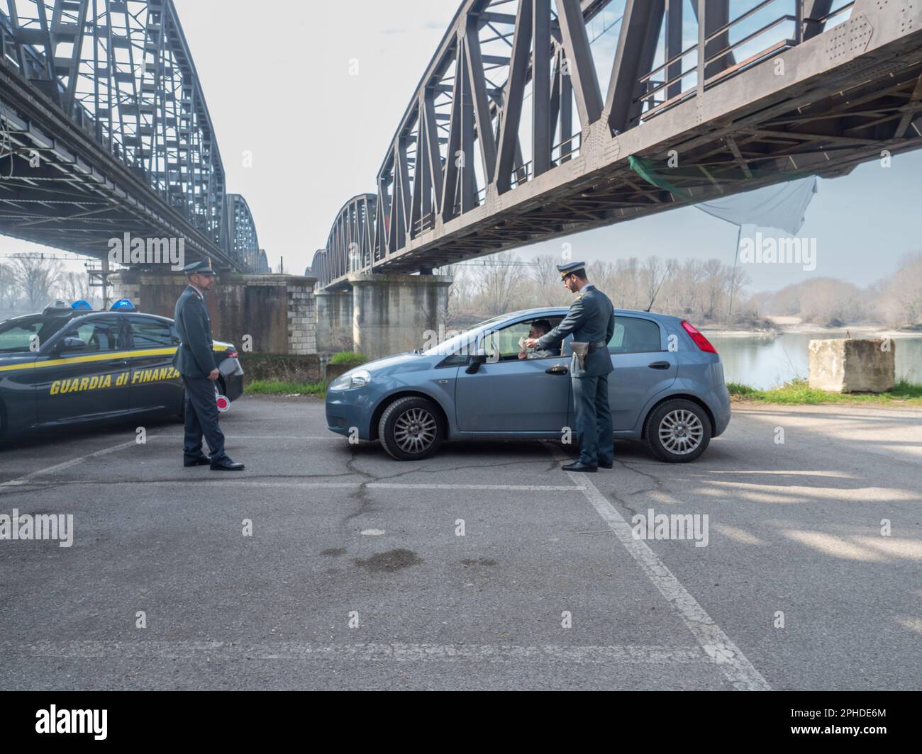 Cremona, Italy - February 2023 two tax police officers in duty near Po ...