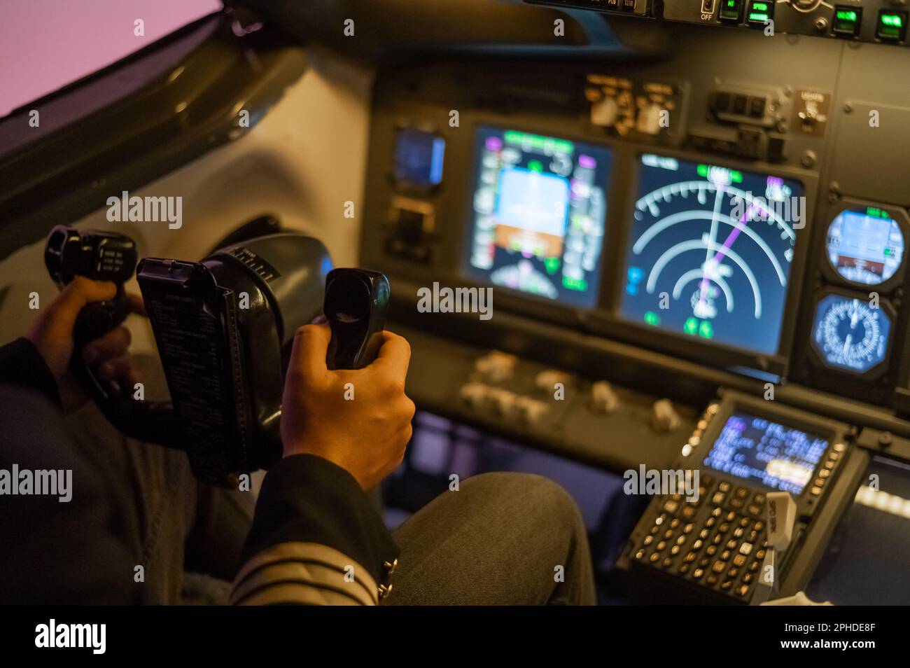 A man is studying to be a pilot in a flight simulator. Close-up of male ...