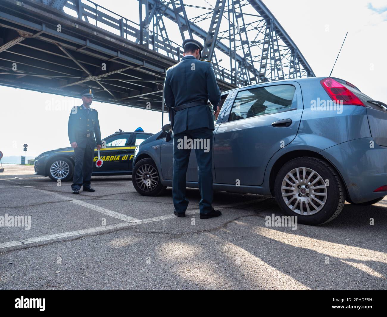 Cremona, Italy - February 2023 two tax police officers in duty near Po ...
