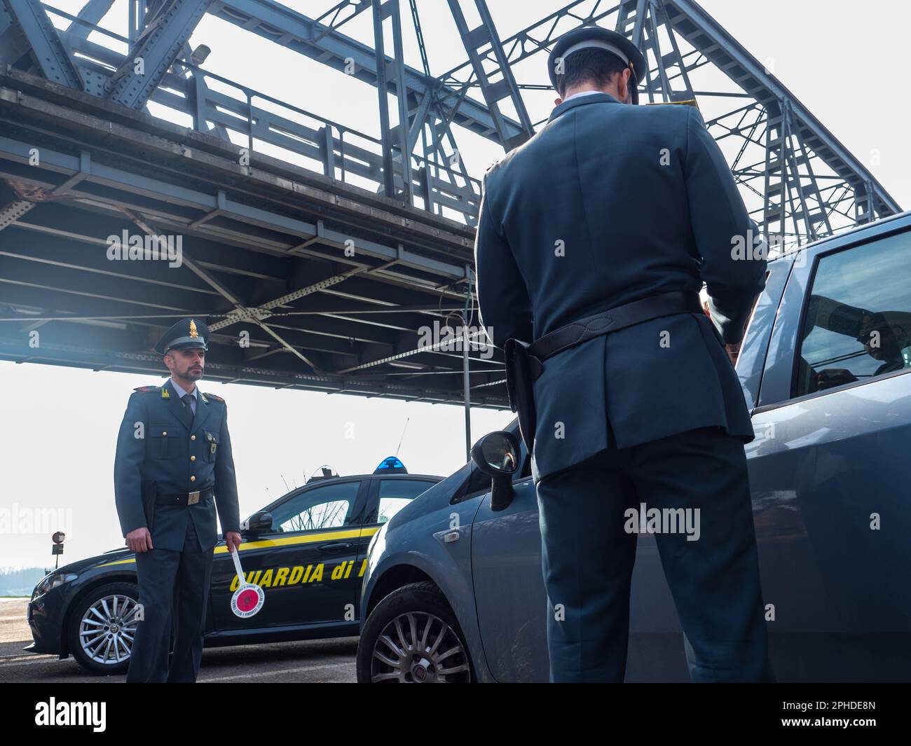 Cremona, Italy - February 2023 two tax police officers in duty near Po ...