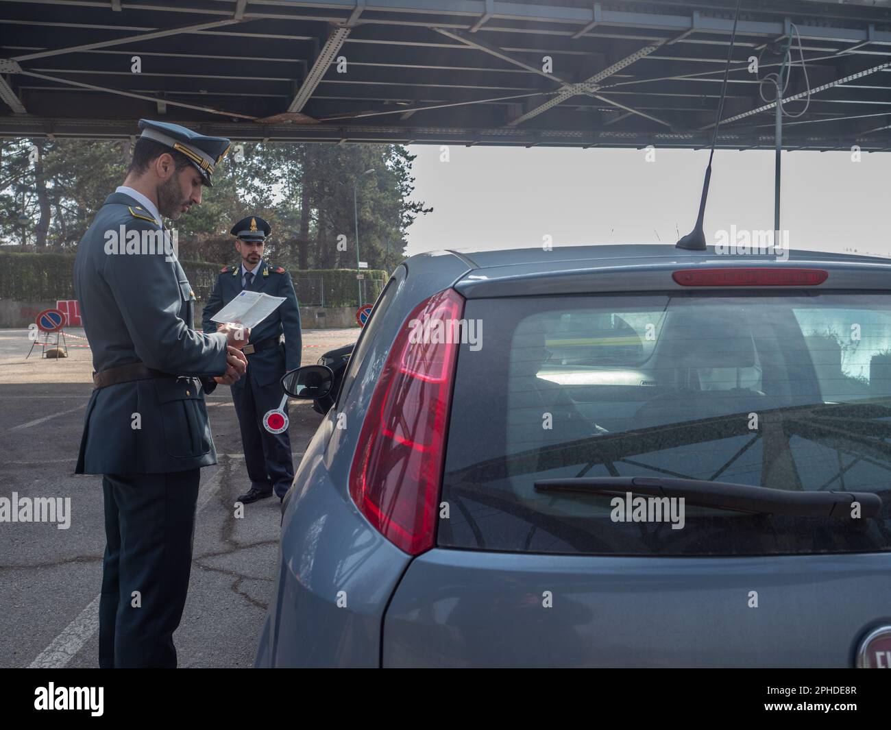 Cremona, Italy - February 2023 two tax police officers in duty near Po ...