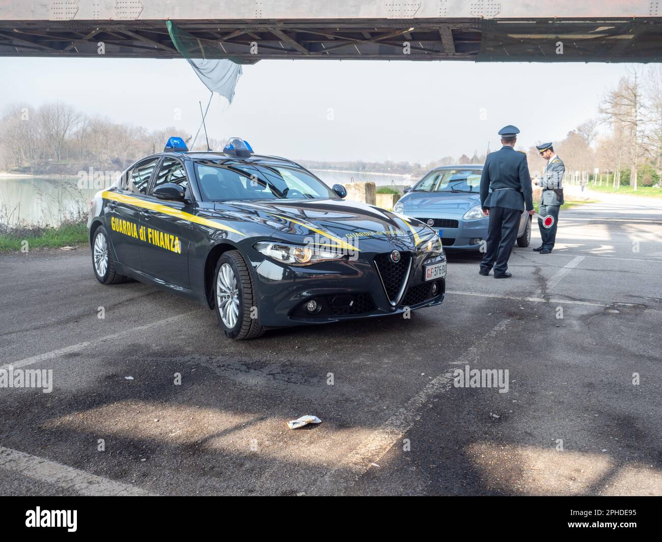 Cremona, Italy - February 2023 two tax police officers in duty near Po ...