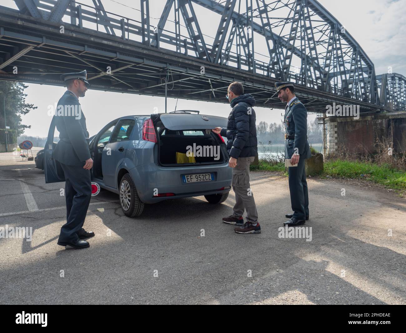 Cremona, Italy - February 2023 two tax police officers in duty near Po ...
