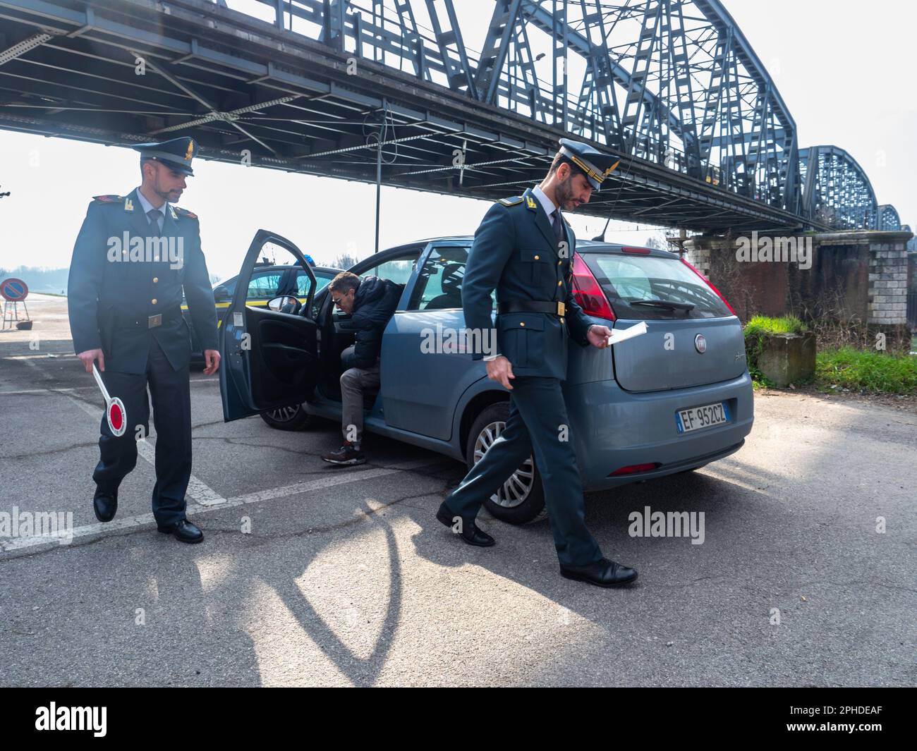 Cremona, Italy - February 2023 two tax police officers in duty near Po ...