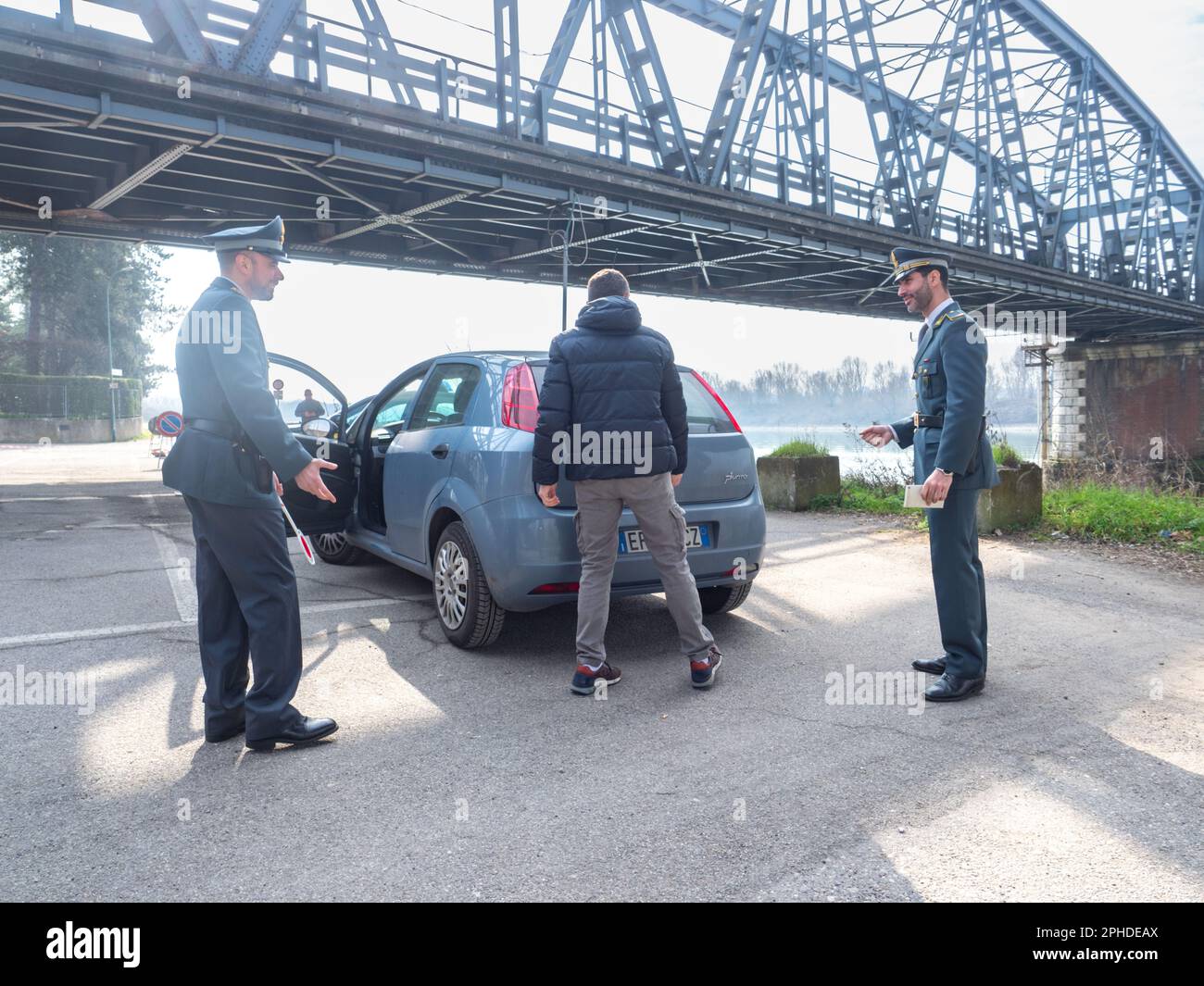 Cremona, Italy - February 2023 two tax police officers in duty near Po ...