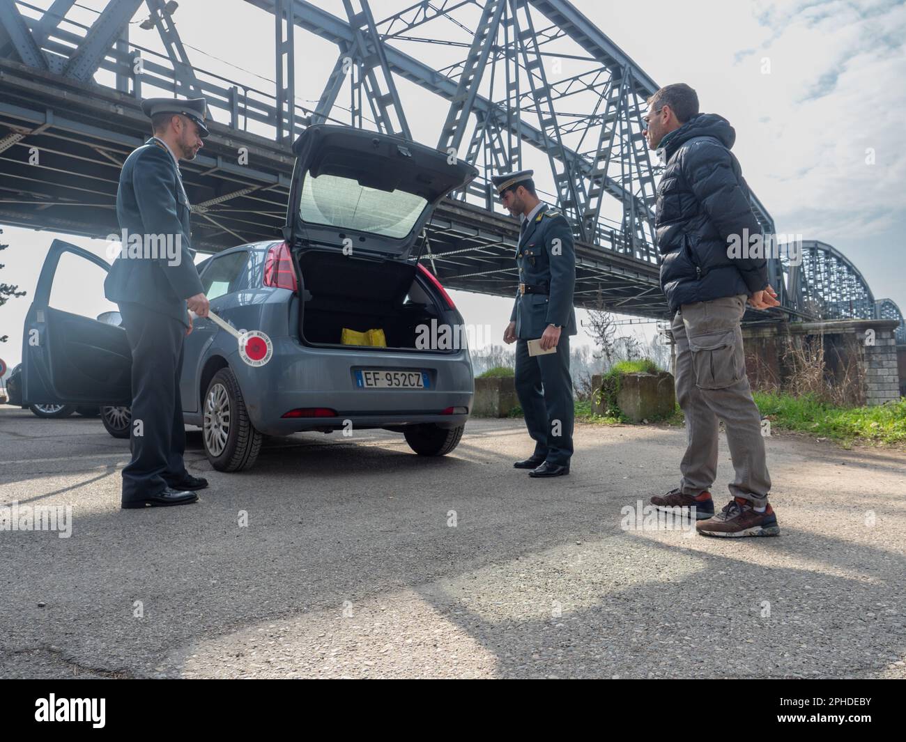 Cremona, Italy - February 2023 two tax police officers in duty near Po ...