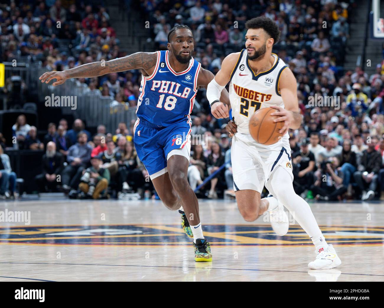 Denver Nuggets guard Jamal Murray, right, drives past Philadelphia ...