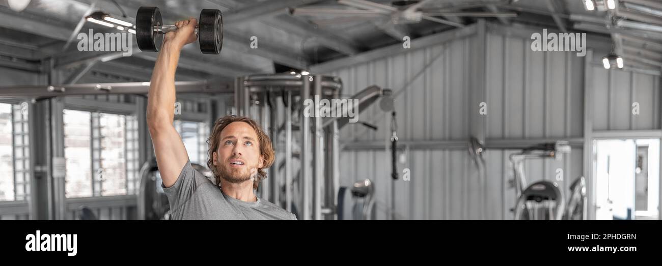 Gym workout fitness banner panoramic man training with dumbbells lifting overhead raise ...