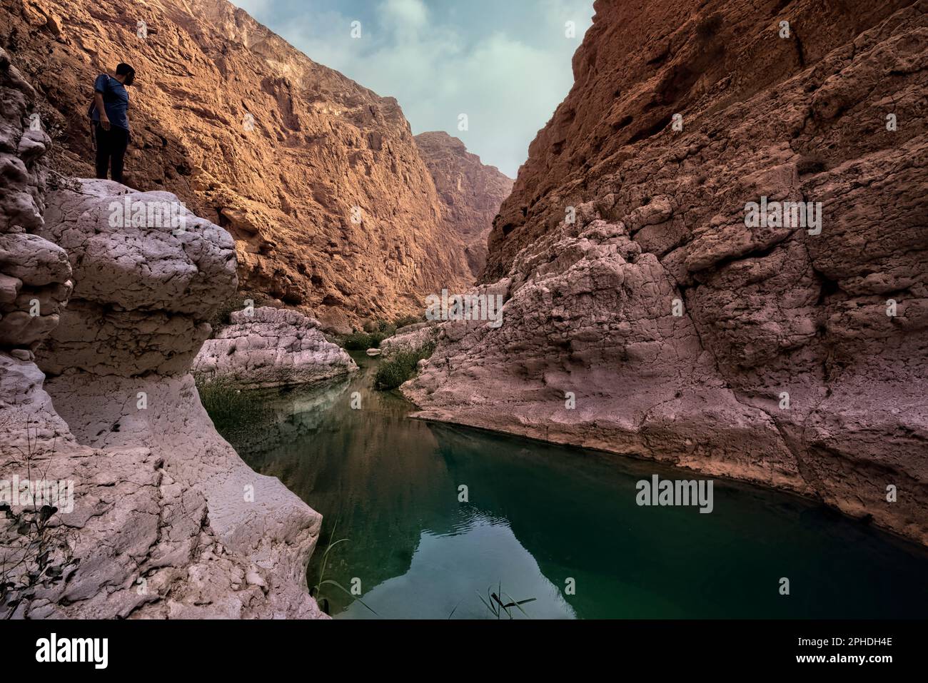 Hiker inside the beautiful Wadi Shab canyon, Wadi Ash Shab, Oman Stock ...