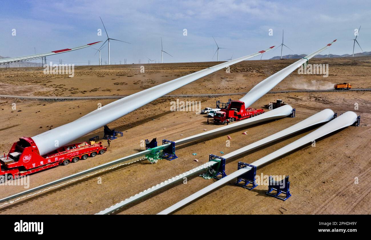 ZHANGYE, CHINA - MARCH 27, 2023 - Builders transfer wind turbine blades ...