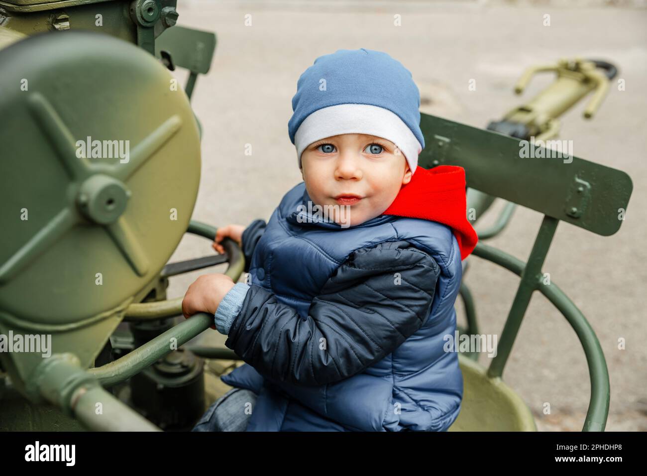 Little boys playing with historical world war tank. Portrait of boy ...
