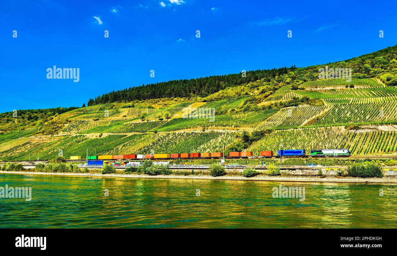 Freight container train at the Rhine River in the Rhine Gorge in ...