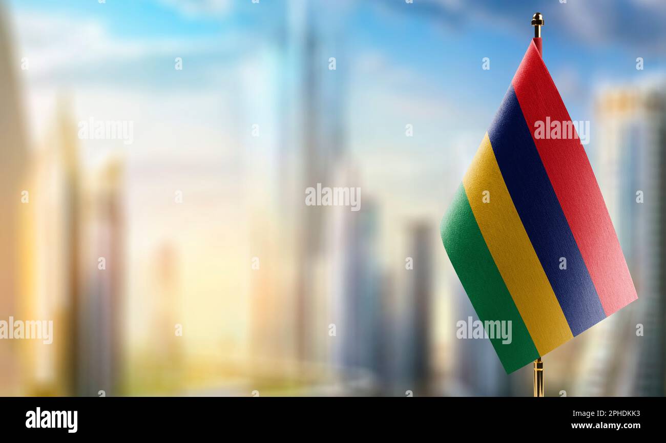 Small flags of the Mauritius on an abstract blurry background Stock ...