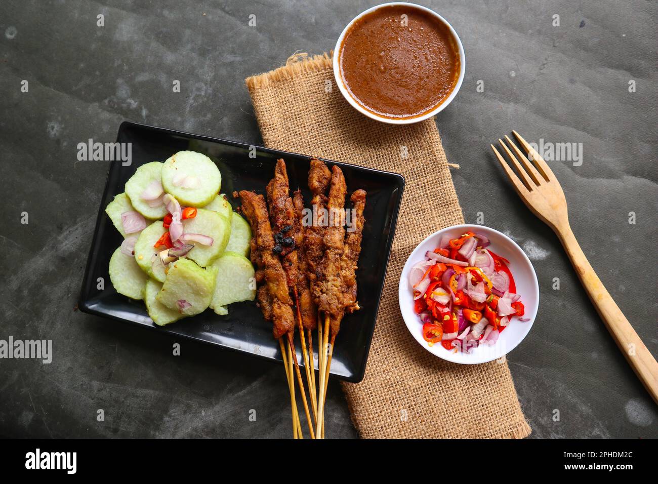 chicken satay or chicken satay served with lontong, rice cake and ...