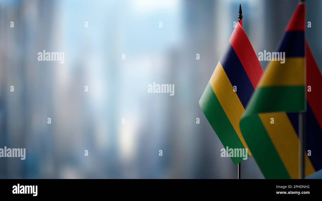 Small flags of the Mauritius on an abstract blurry background Stock ...