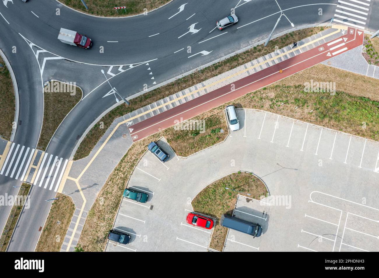 cars traffic on the roundabout. parking lot with parked cars. city transport infrastructure ...