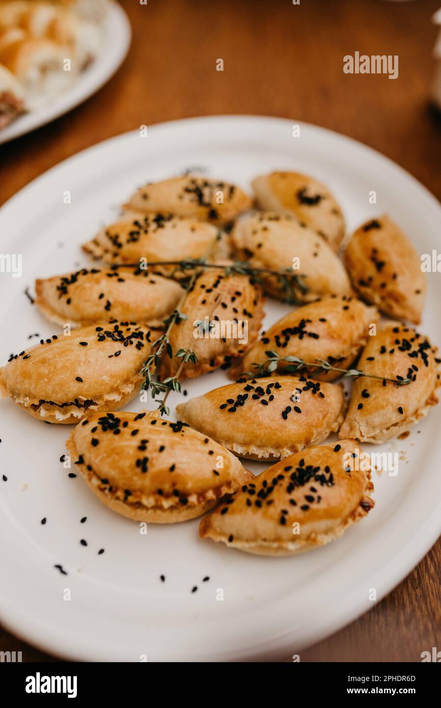 A vertical photograph of a plate of freshly prepared empanadas Stock ...