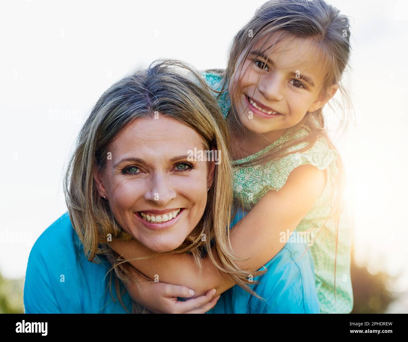 Mommys growing girl. Portrait of a happy mother and daughter enjoying a ...