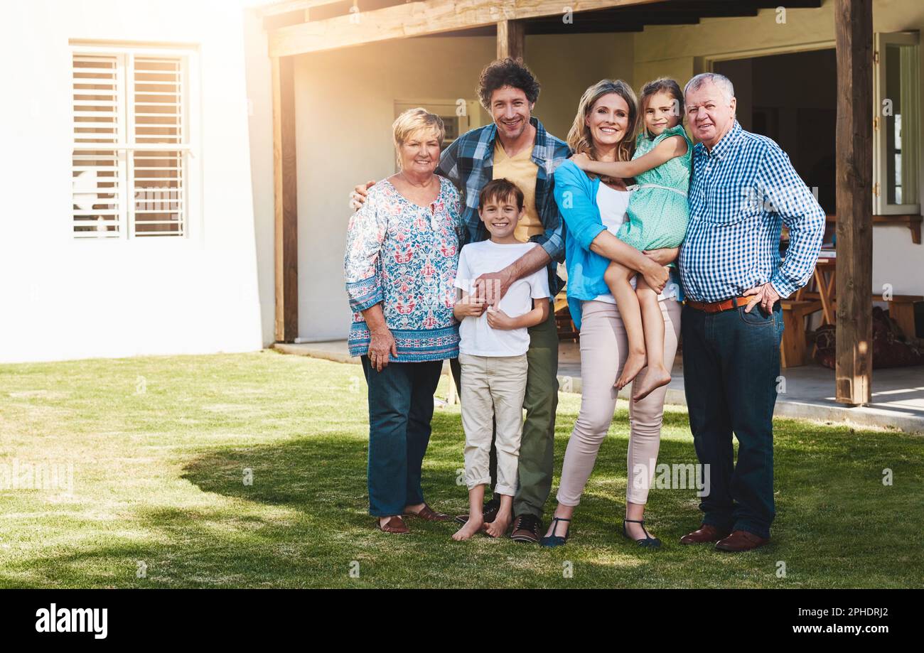 Family is the foundation of a home. Portrait of three generations of ...