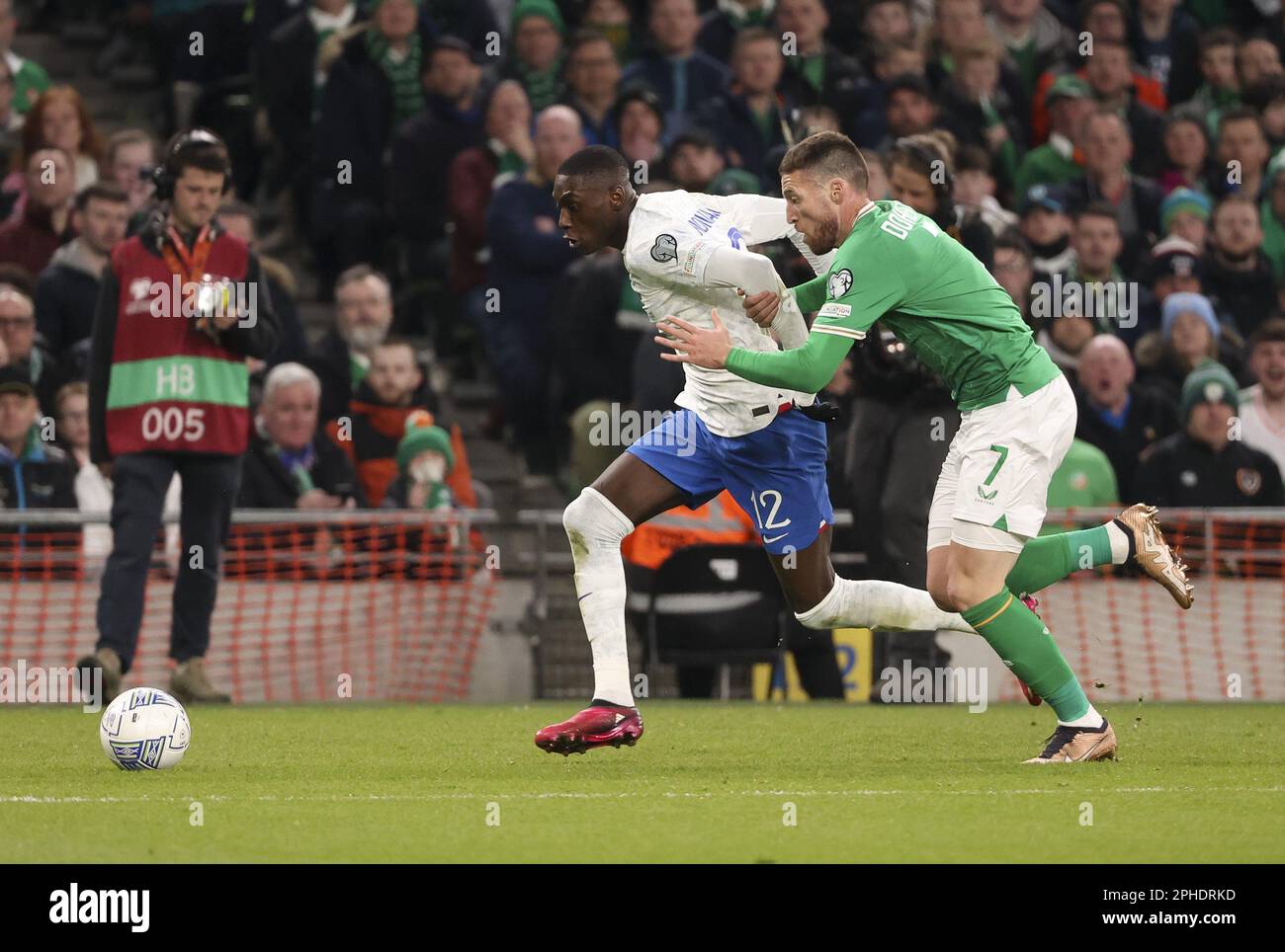 Rando Kolo Muani of France, Matthew Doherty of Ireland during the UEFA ...