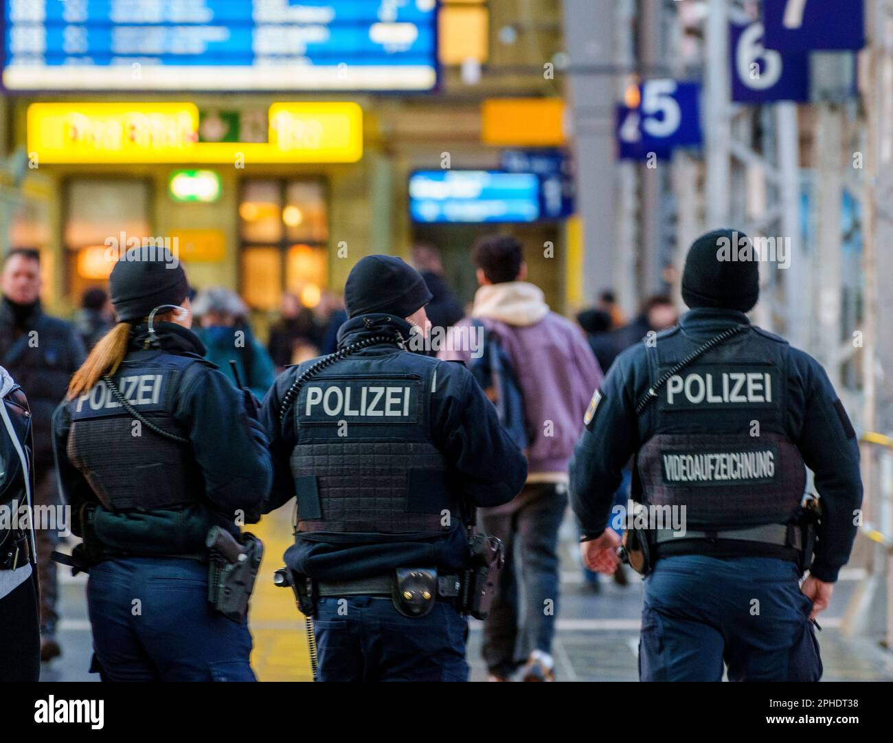 28 March 2023, Hesse, Frankfurt/Main: Three police officers walk ...