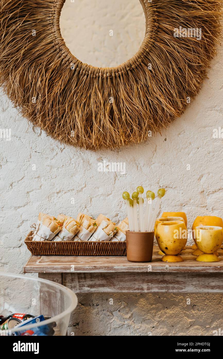 A vertical photograph of a snack counter filled with a variety of ...