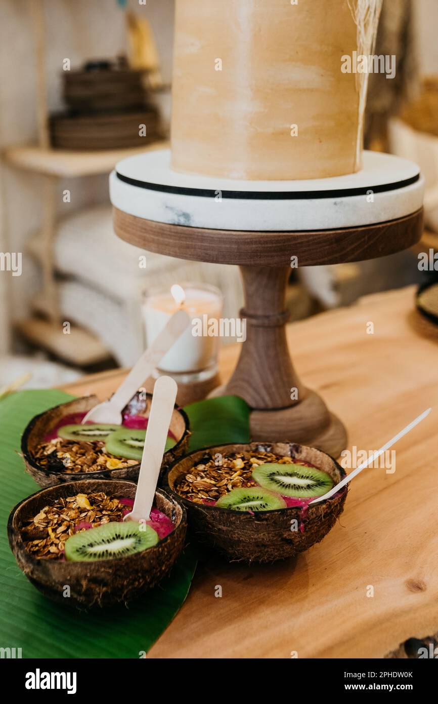 A high-resolution closeup image of a desert in a coconut shell, with ...