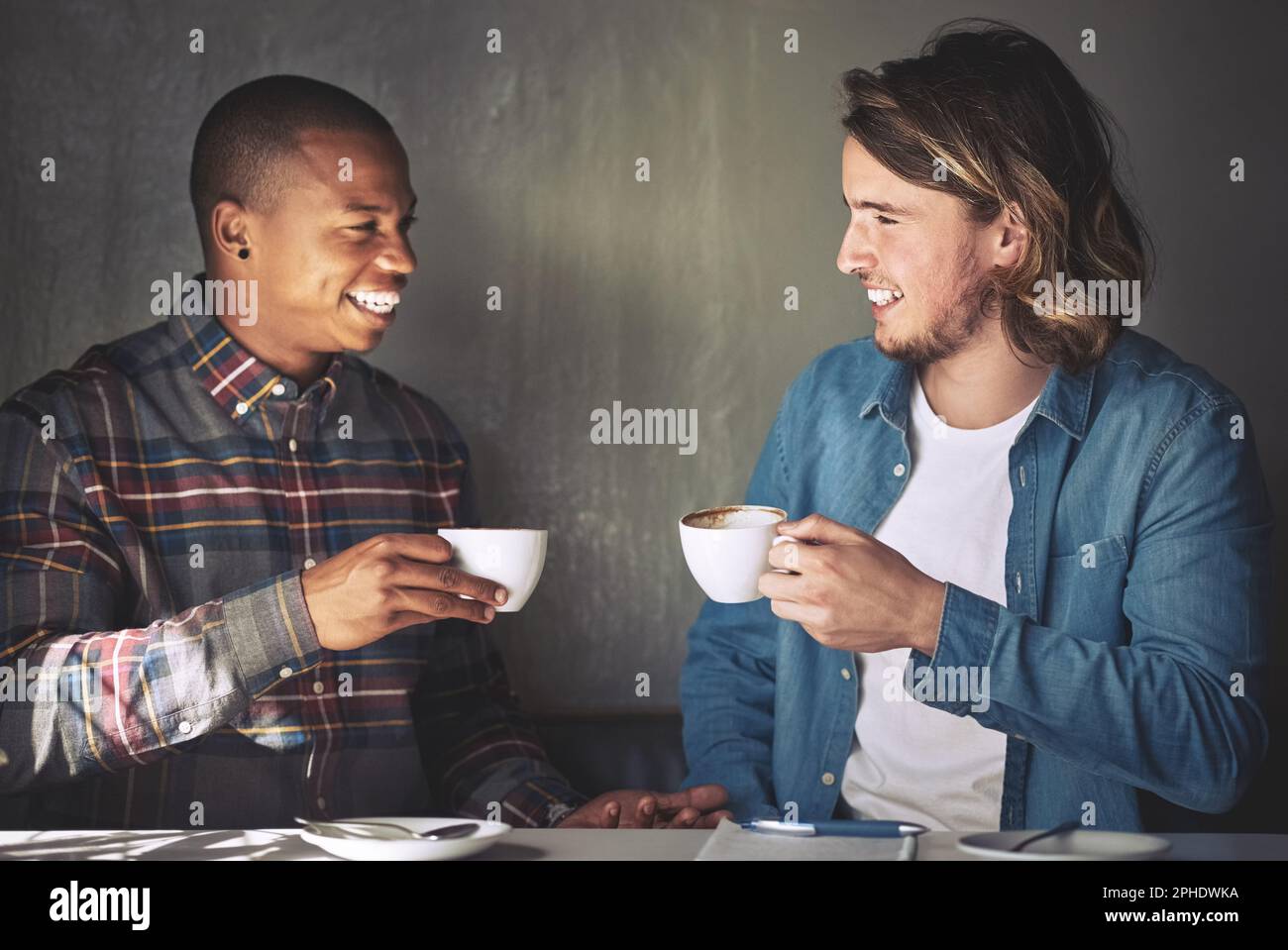 Theres always time for coffee. two friends having coffee together in a ...