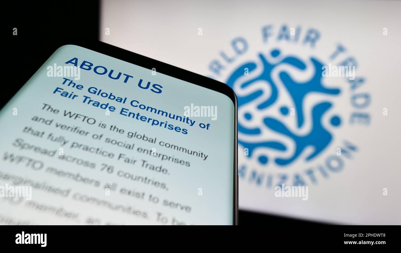 Mobile phone with website of World Fair Trade Organization (WFTO) on ...