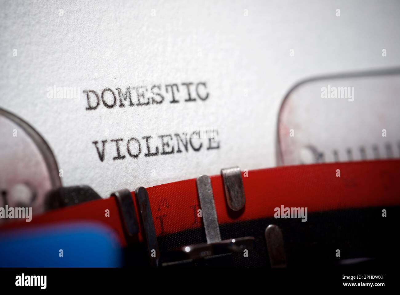 Domestic violence text written with a typewriter Stock Photo - Alamy