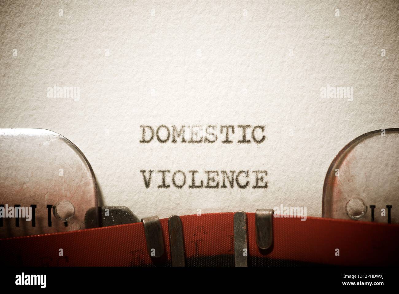 Domestic violence text written with a typewriter Stock Photo - Alamy
