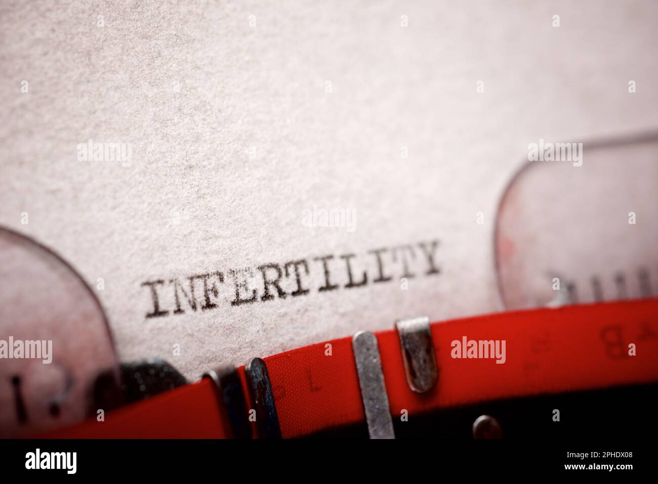 Infertility word written with a typewriter Stock Photo - Alamy