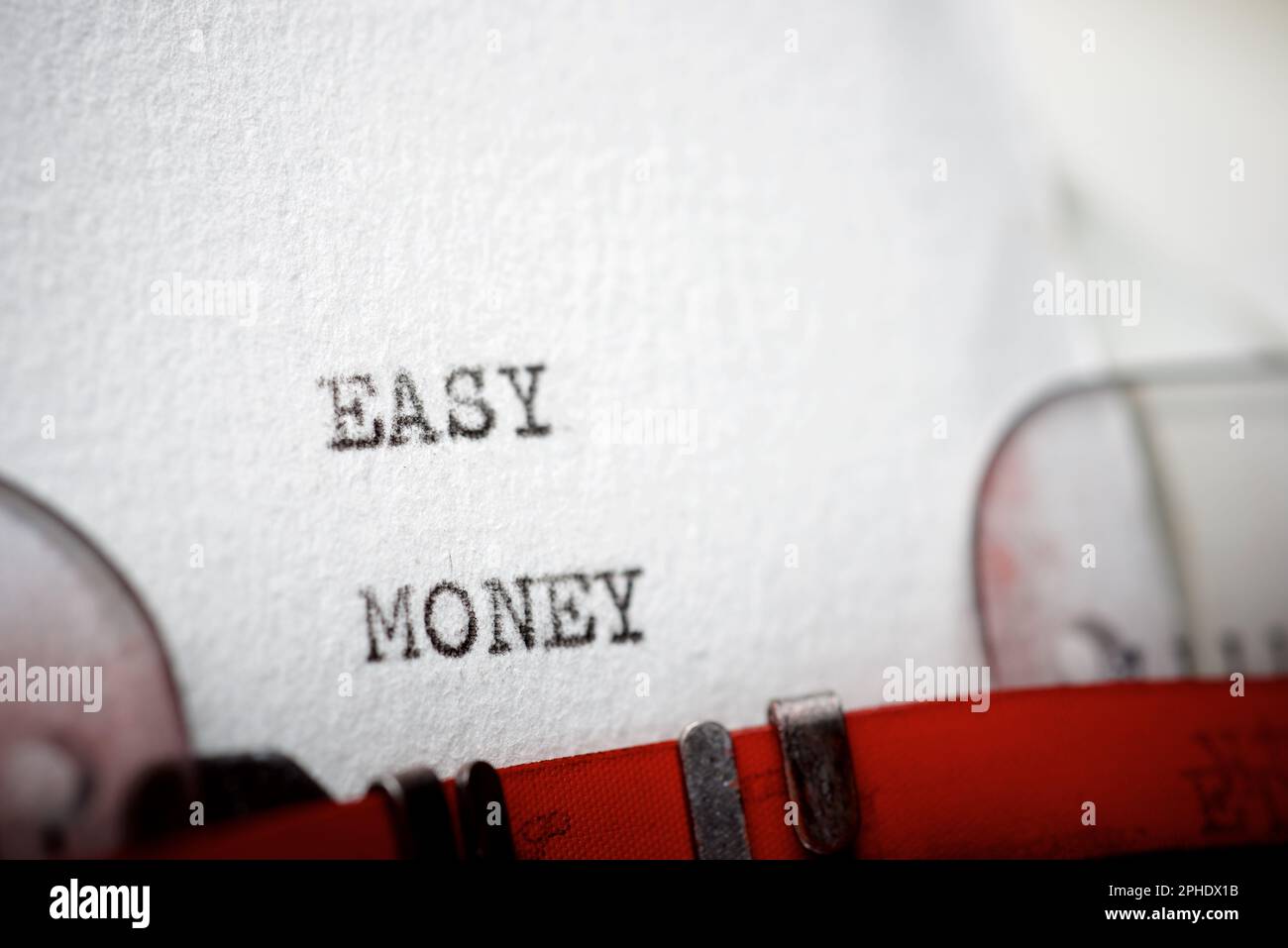 Easy money text written with a typewriter Stock Photo - Alamy