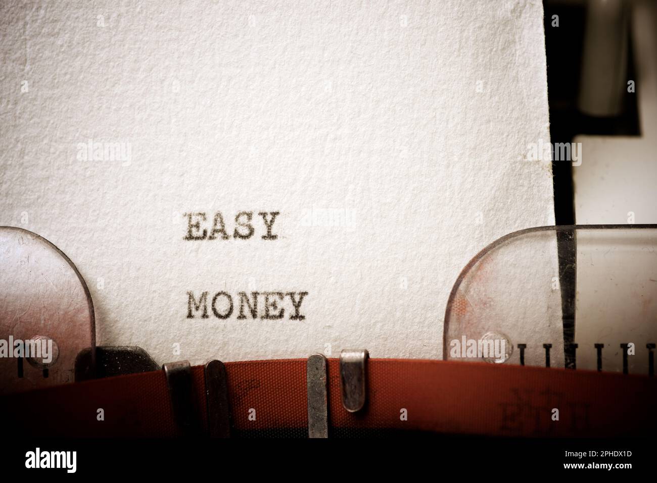 Easy money text written with a typewriter Stock Photo - Alamy