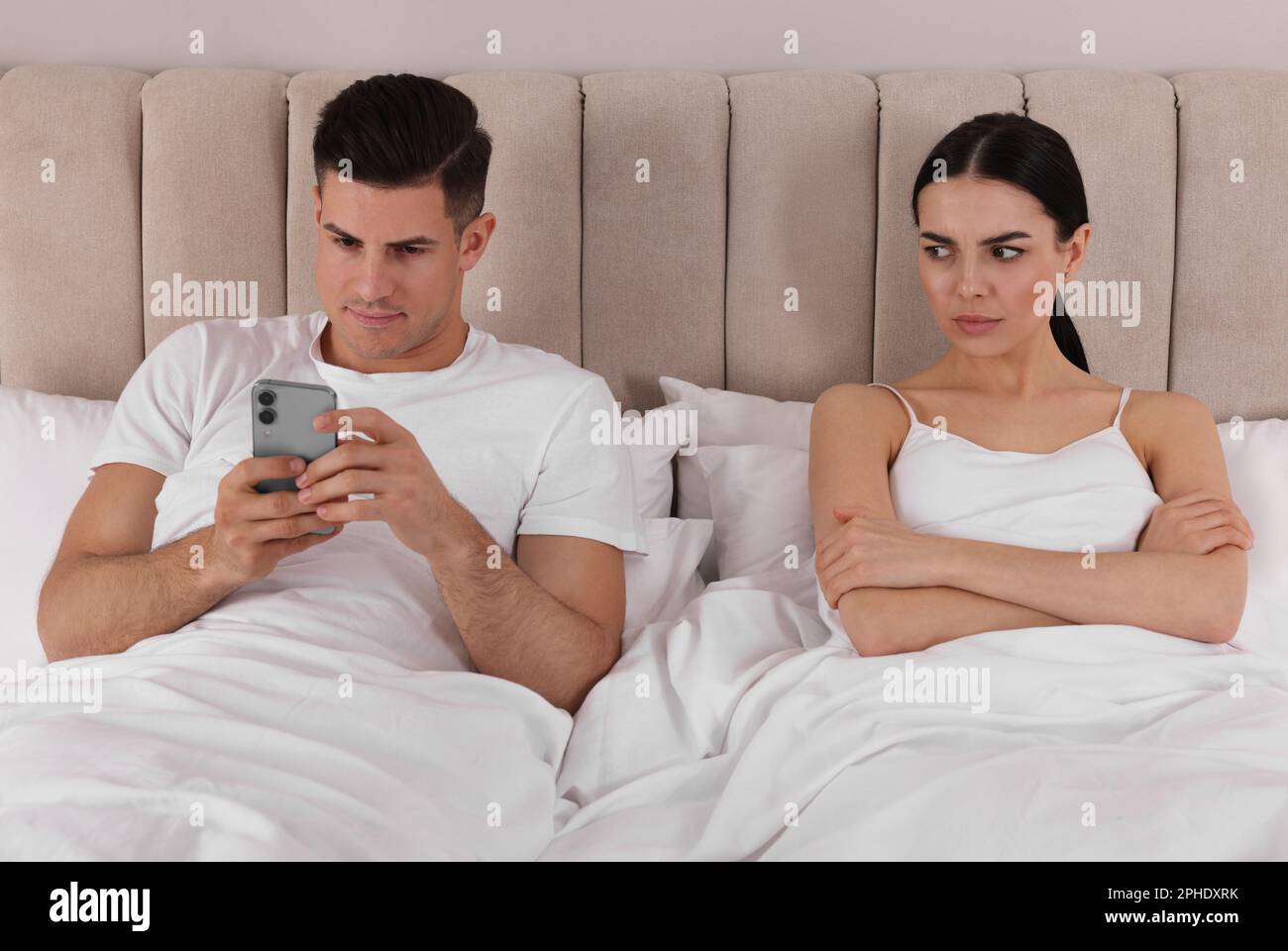 Internet addiction. Man with smartphone ignoring his girlfriend in ...
