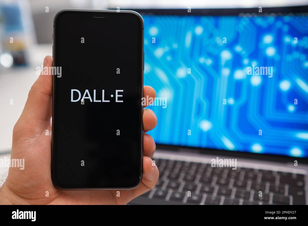 Dall E logo on the smartphone and neural network on the laptop display ...