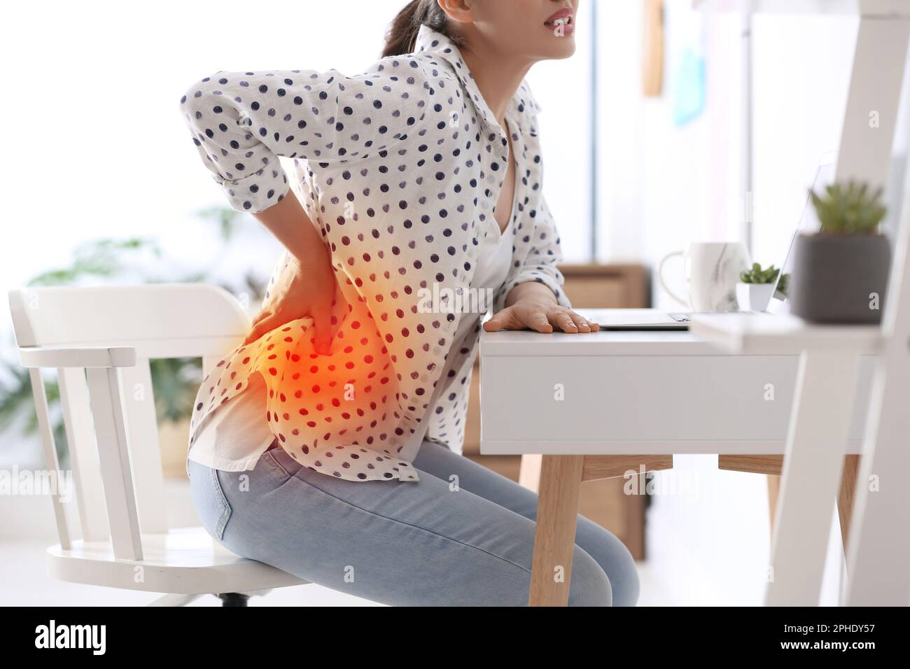 Woman suffering from back pain in office. Bad posture problem Stock ...