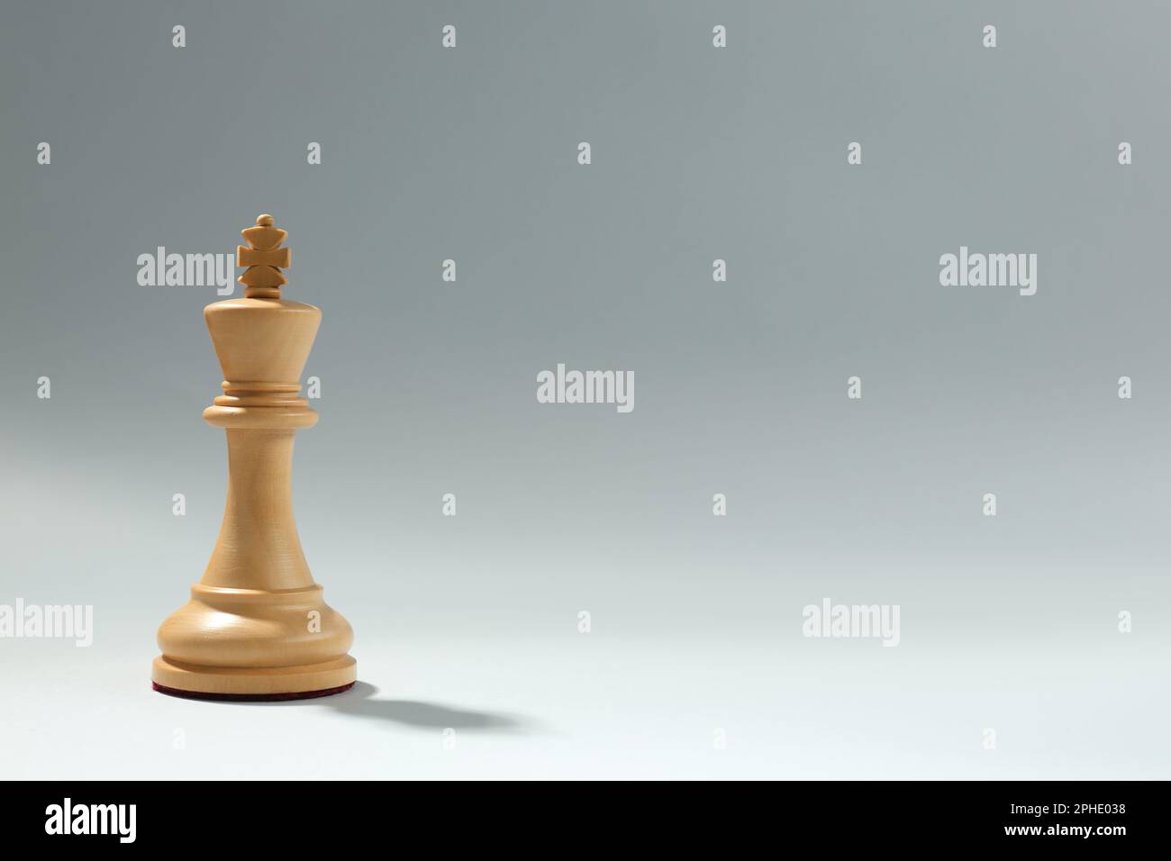 Wooden king on light background, space for text. Chess piece Stock ...