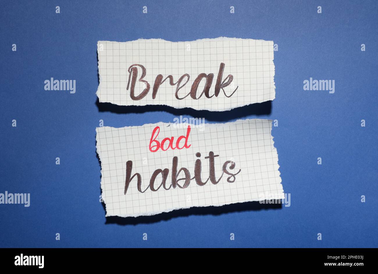 Torn paper with phrase Break Bad Habits on blue background, flat lay ...