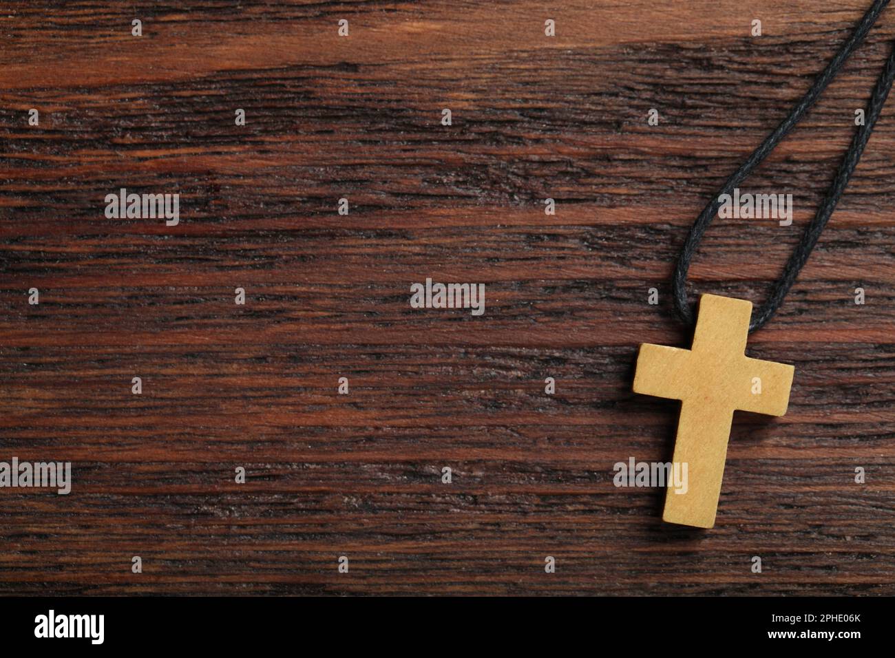 Wooden Christian cross on table, top view. Space for text Stock Photo ...