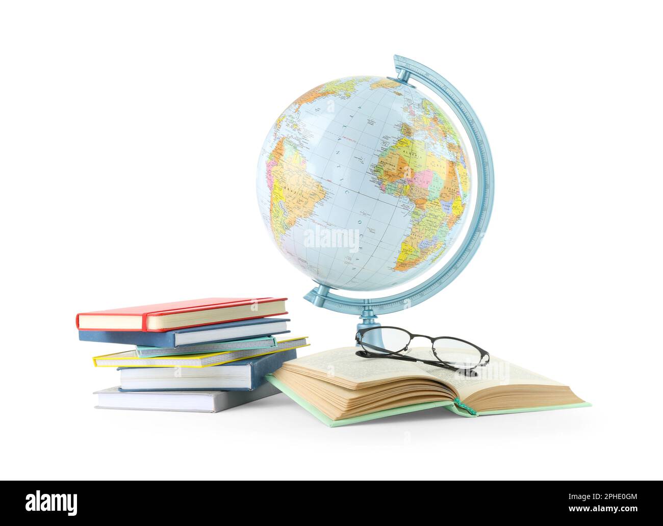 Plastic model globe of Earth, books and eyeglasses on white background ...