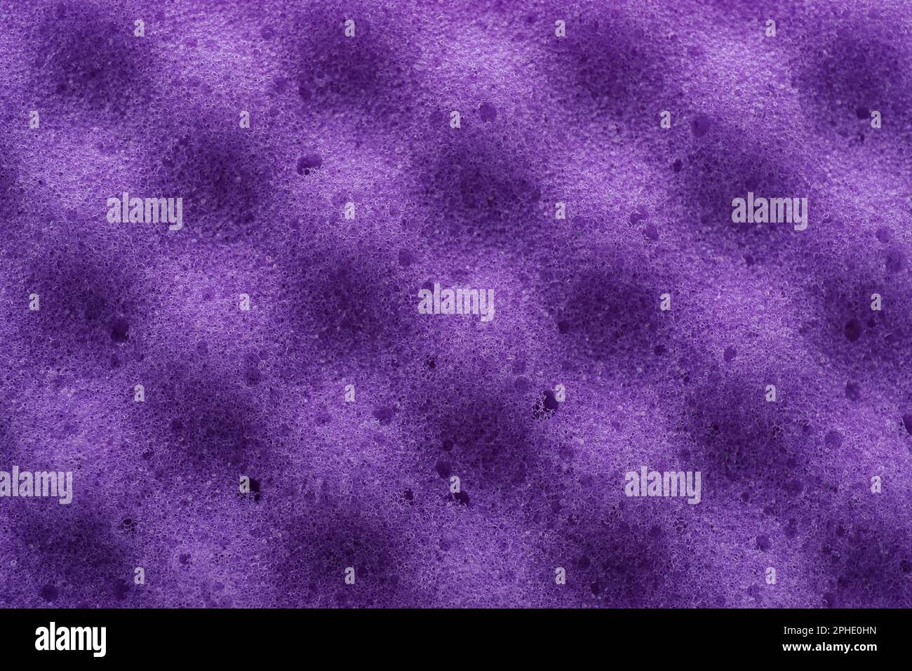 Purple cleaning sponge as background, top view Stock Photo - Alamy