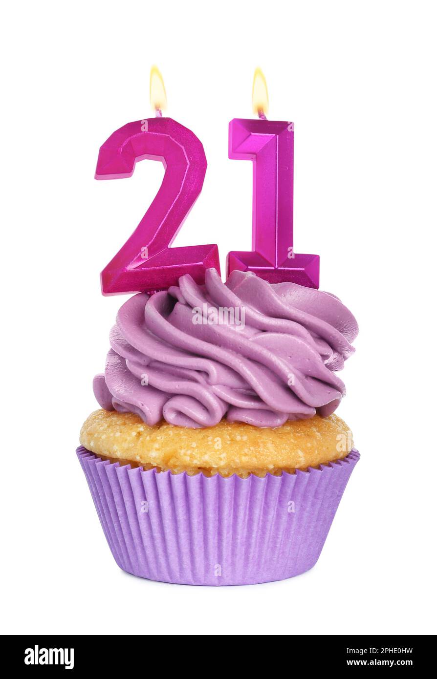 Delicious cupcake with number shaped candles on white background ...
